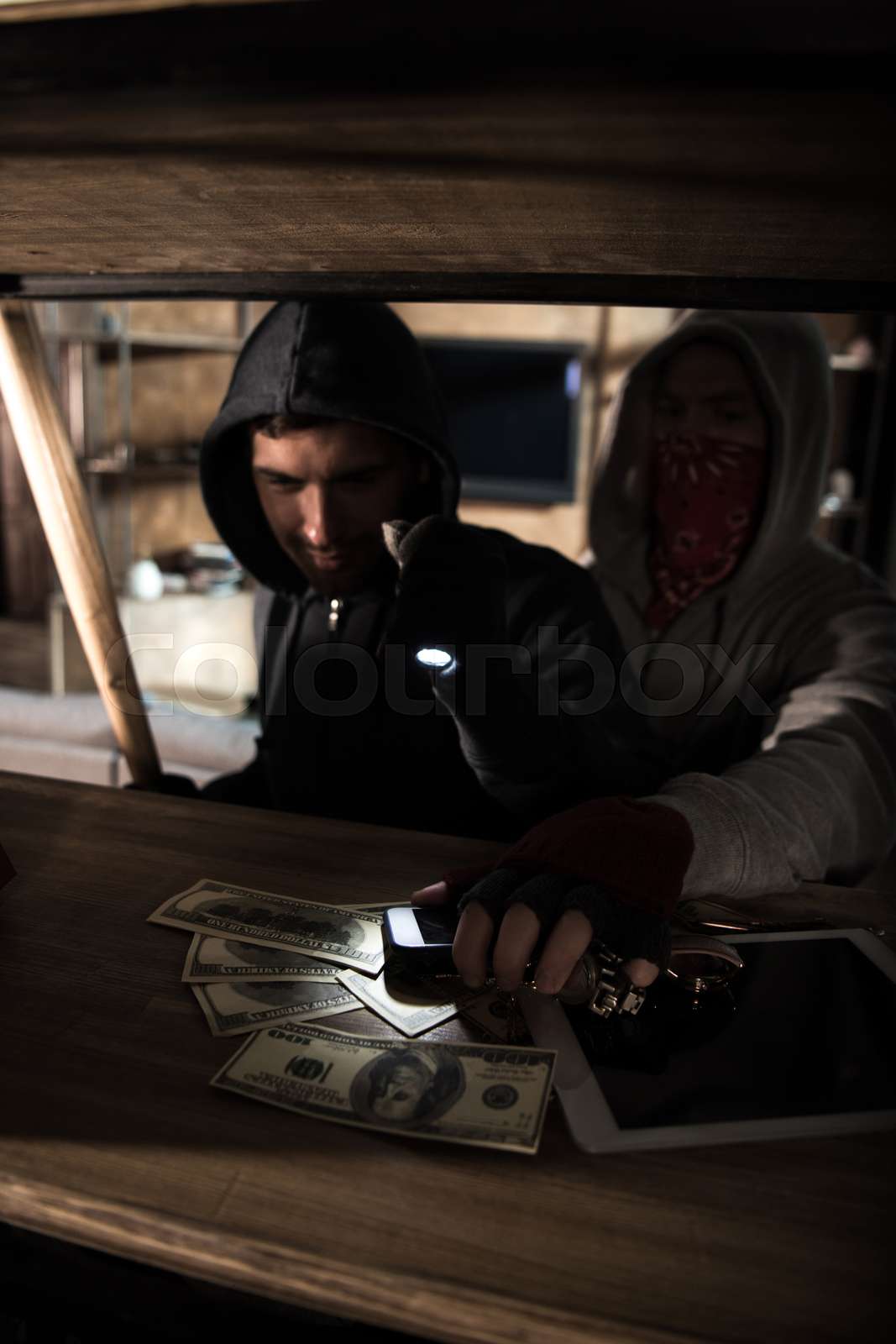 Robbers stealing money | Stock image | Colourbox