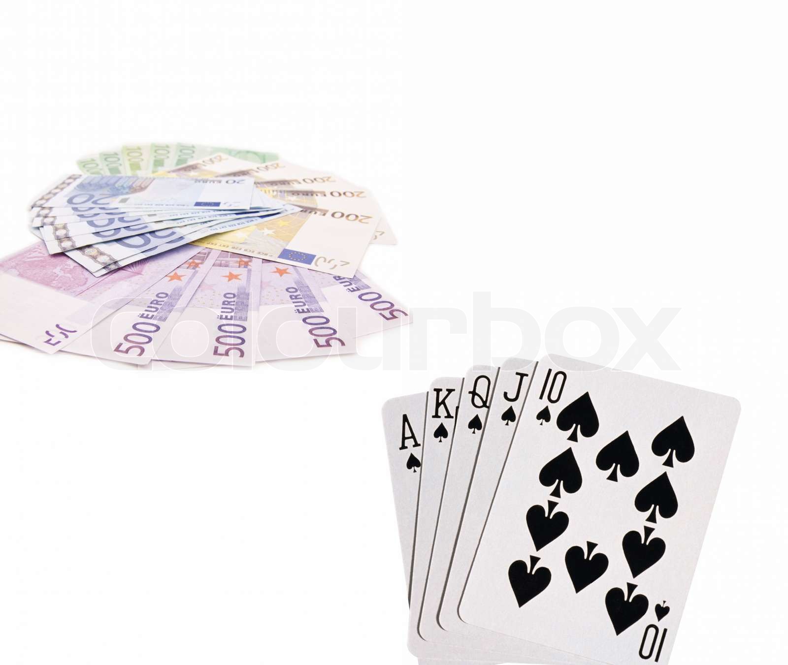 Playing cards and money on | Stock image | Colourbox
