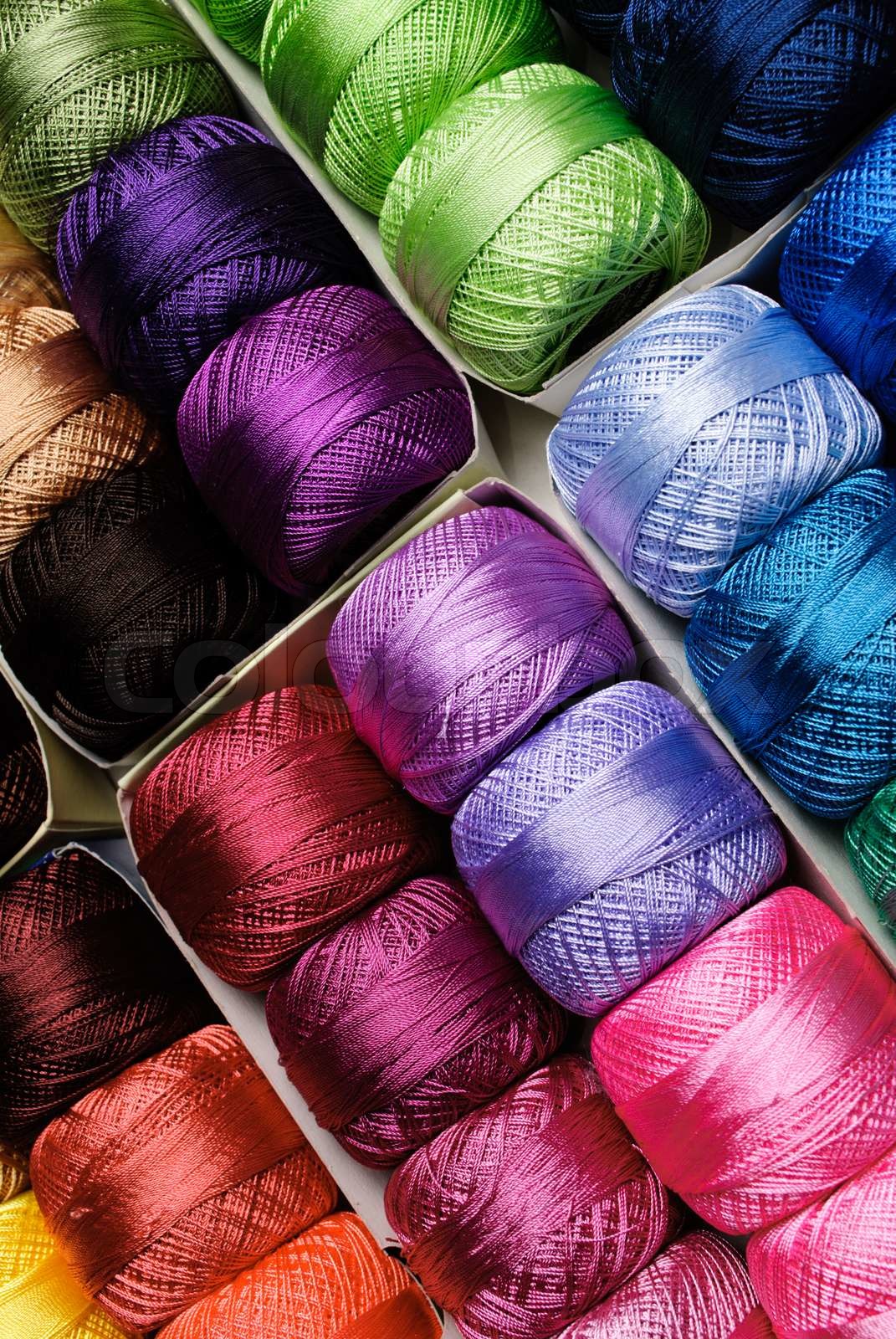 Different color threads on rows in the store | Stock image | Colourbox
