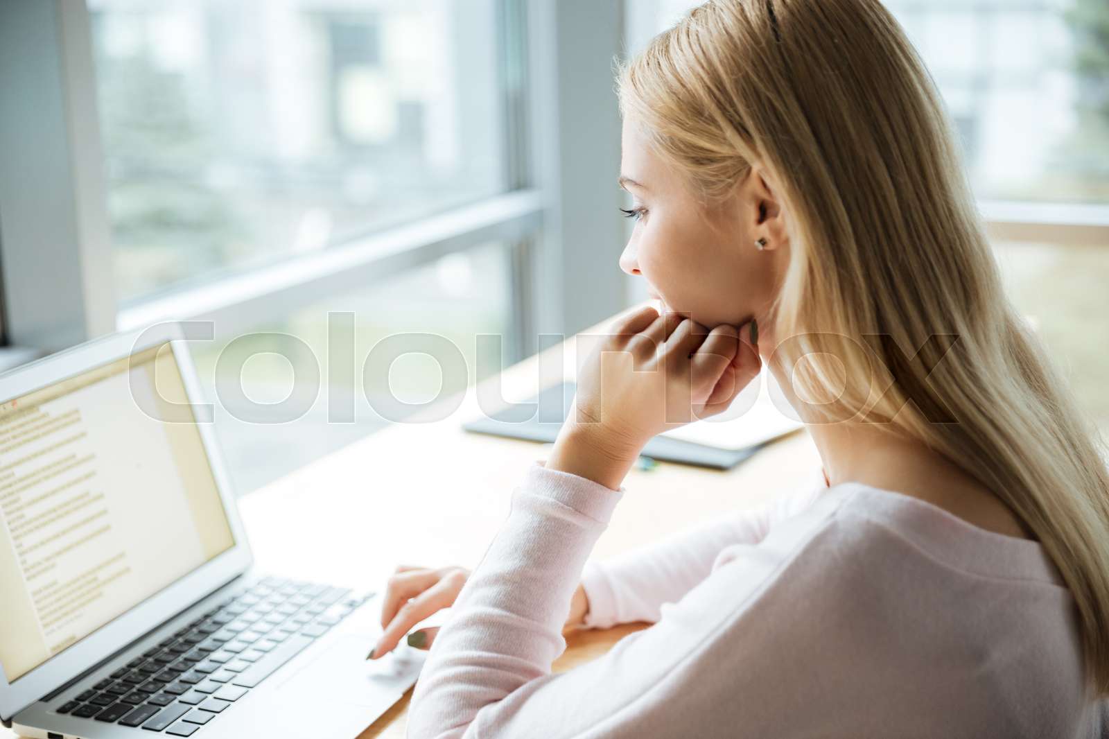 Side view image of young lady using laptop computer | Stock image ...