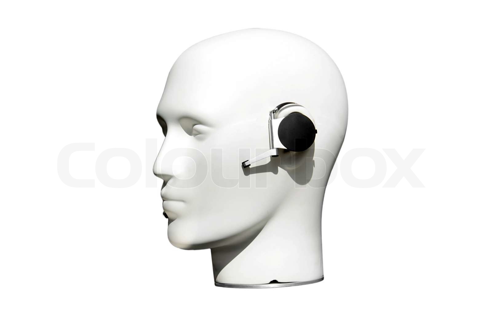 headphones on a human head model over white | Stock image | Colourbox