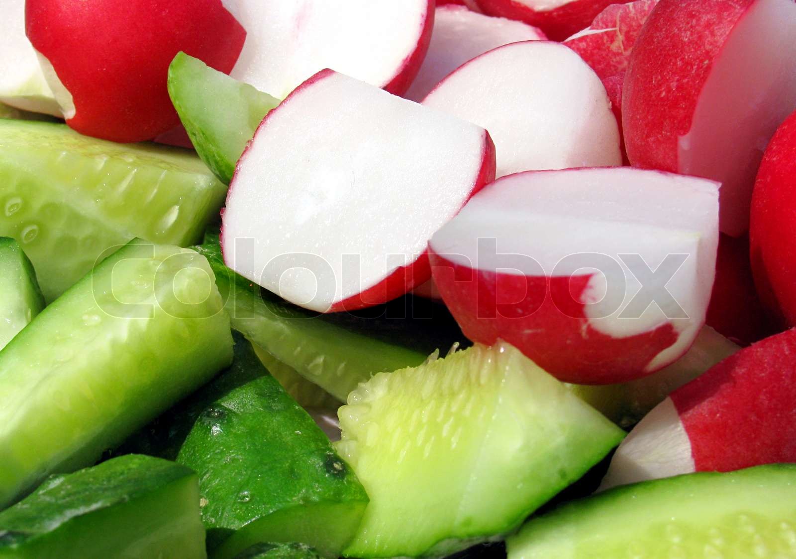 fresh cutted vegetables: cucumbers and radish | Stock image | Colourbox