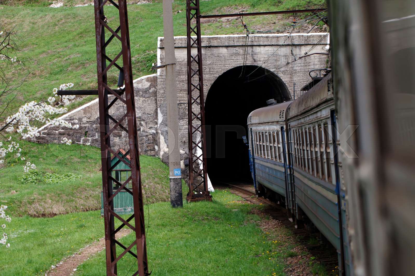 Transportation railway train enters the tunnel | Stock image | Colourbox