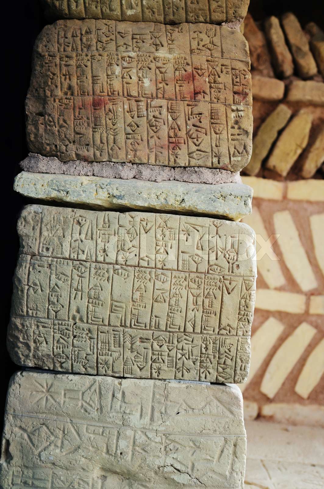 This photograph represent natural stones with ancient Sumerian writing ...