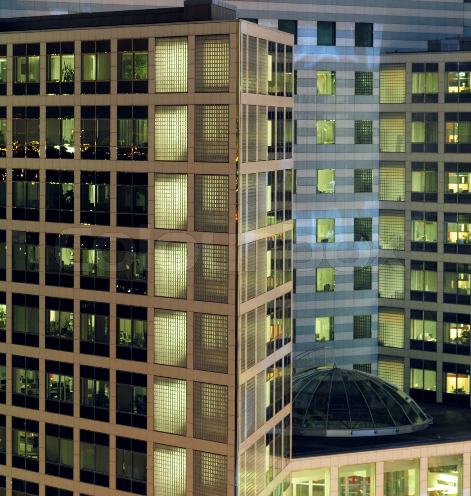 This photograph represent a modern texture of glass building at night ...