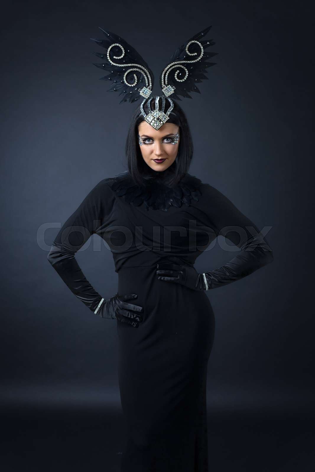 woman in costume of black bird | Stock image | Colourbox