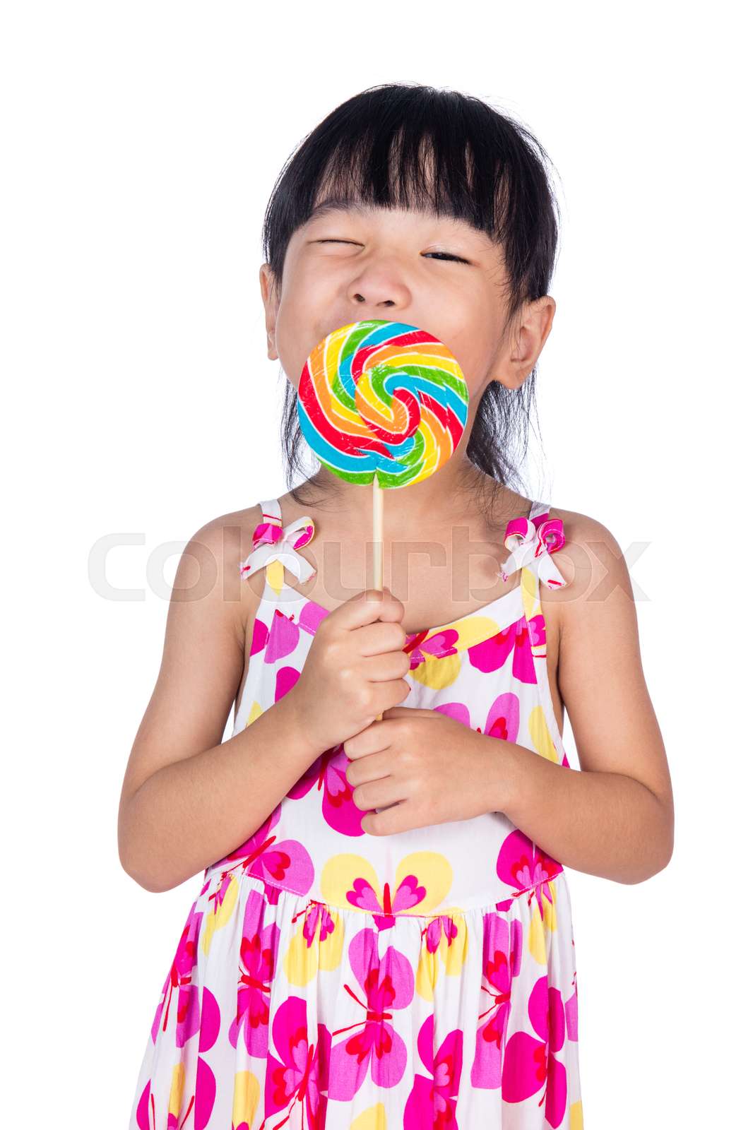 Asian Little Chinese girl eating lollipop | Stock image | Colourbox