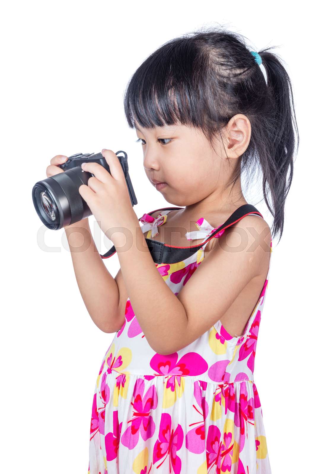 Asian Little Chinese girl holding a camera | Stock image | Colourbox