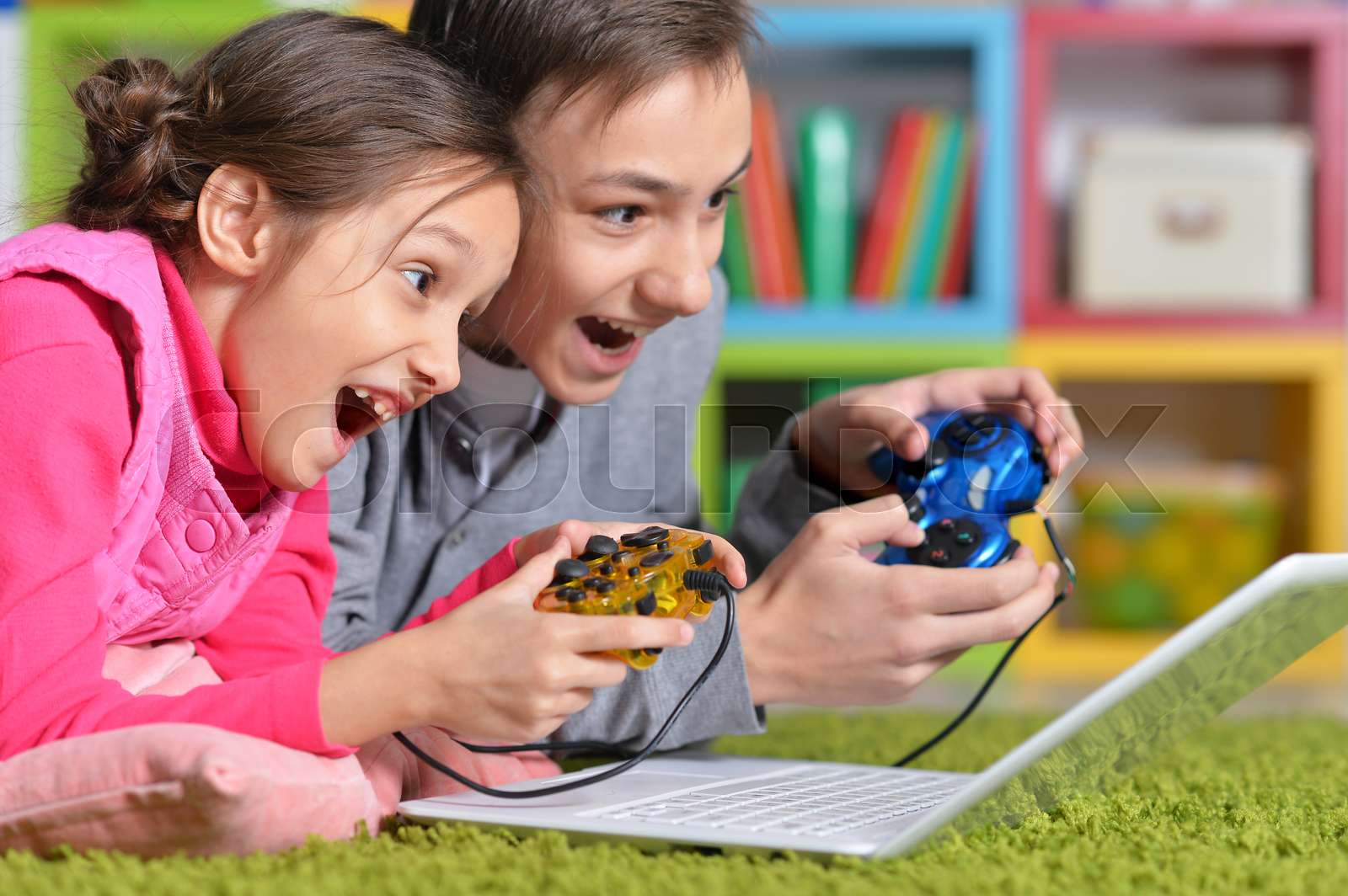 brother and sister playing computer game | Stock image | Colourbox