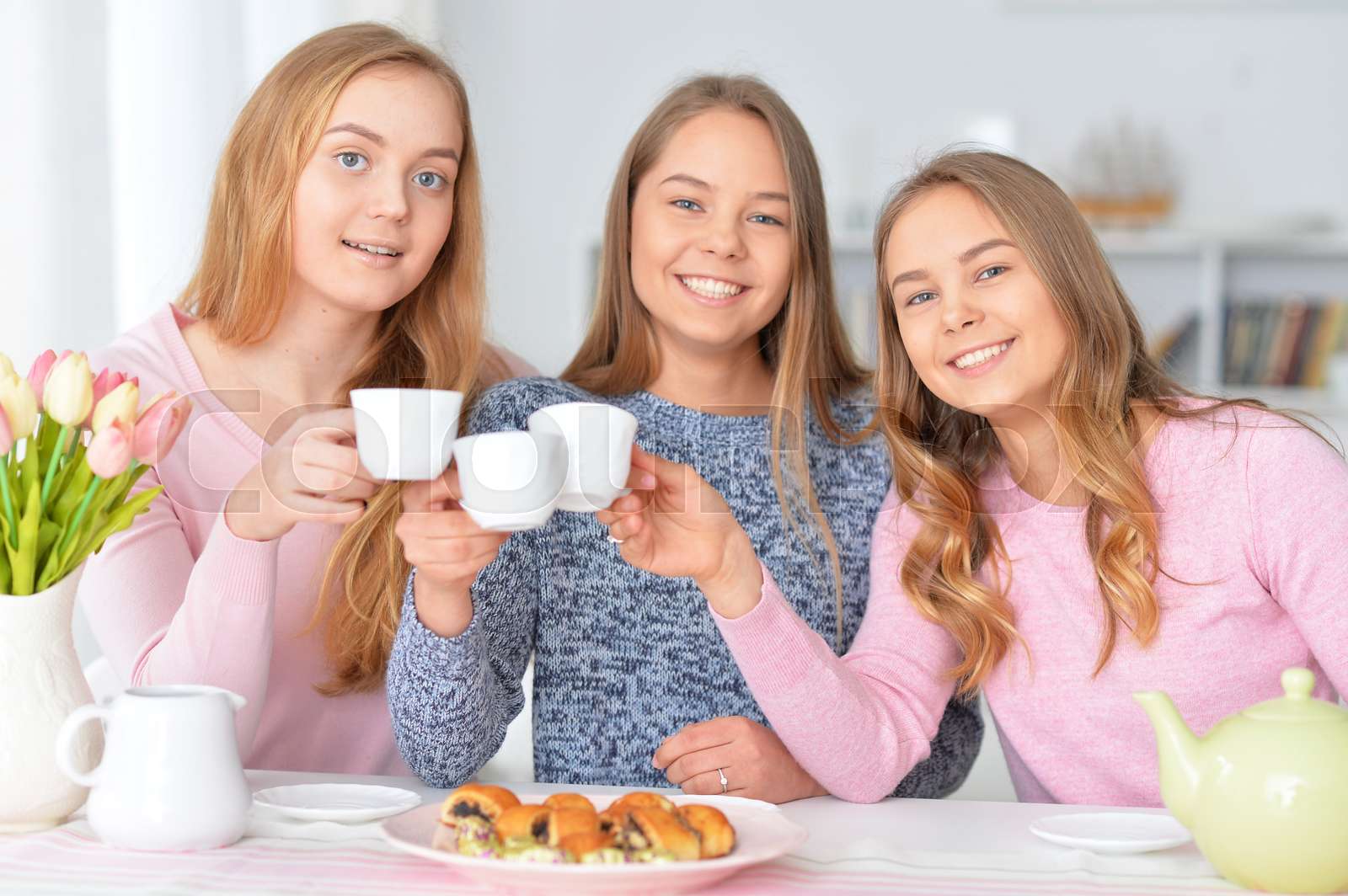 Teenage girls drinking tea | Stock image | Colourbox