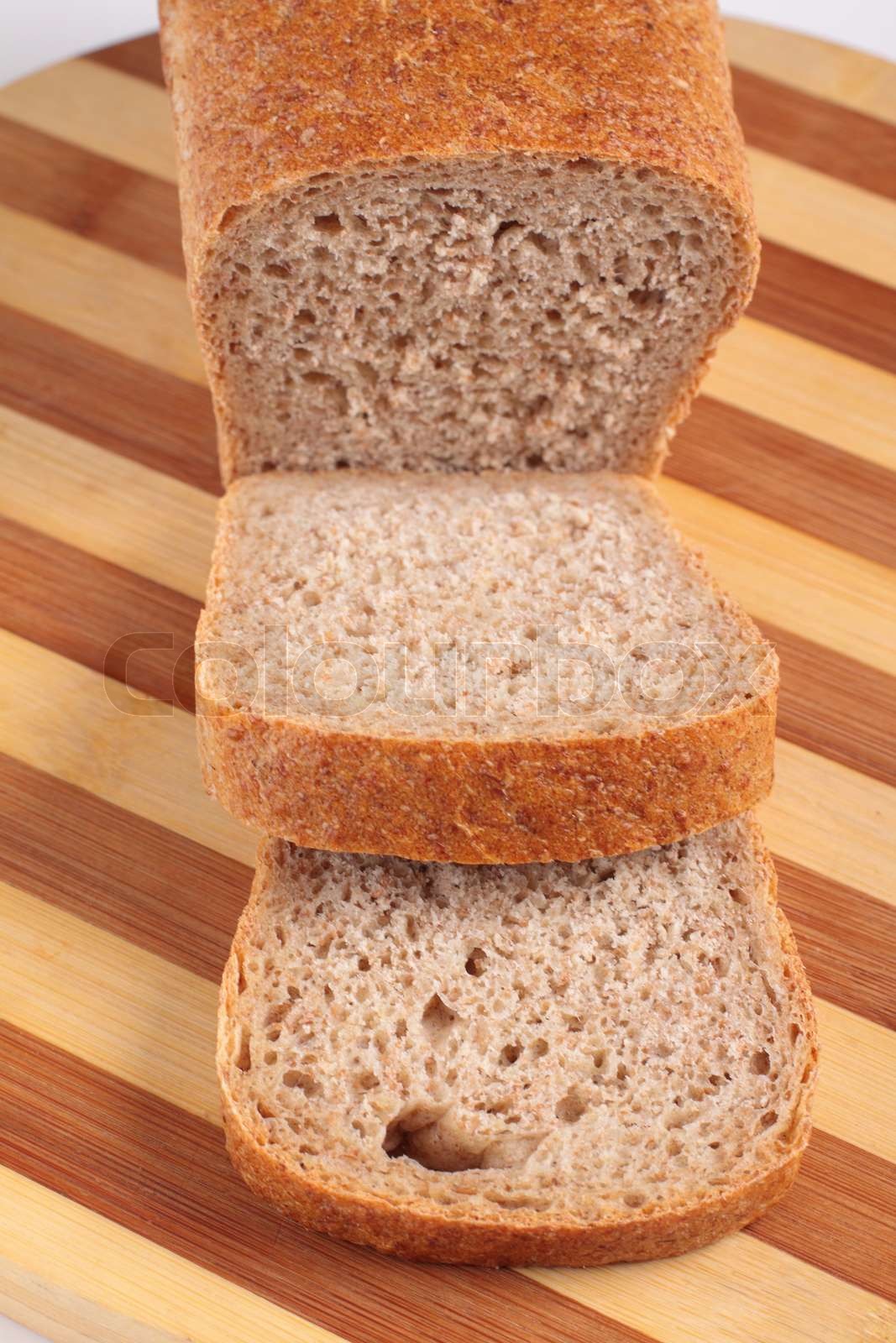 sliced gray bread isolated on white background | Stock image | Colourbox