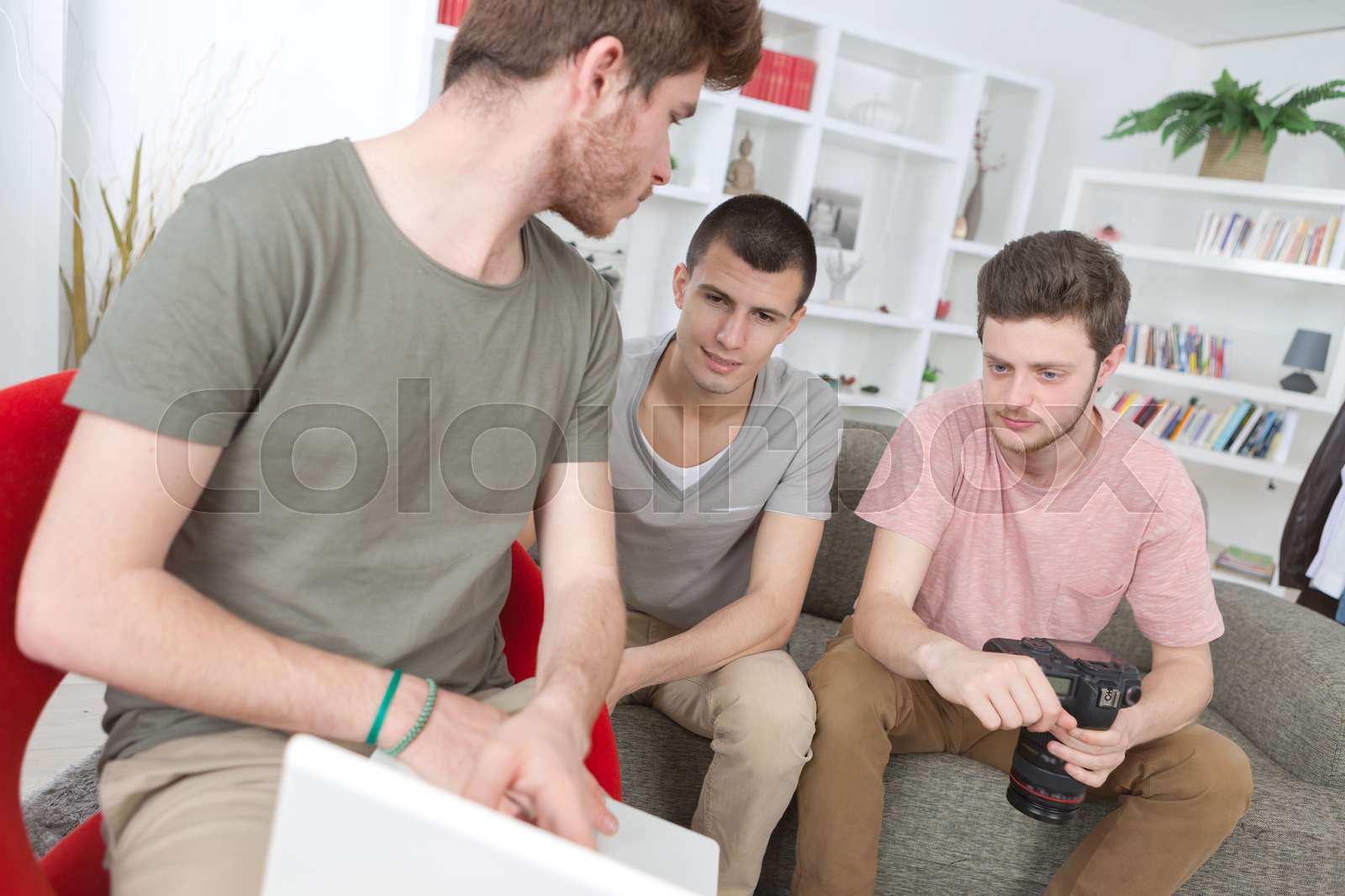 photographer teaches friends how to work | Stock image | Colourbox
