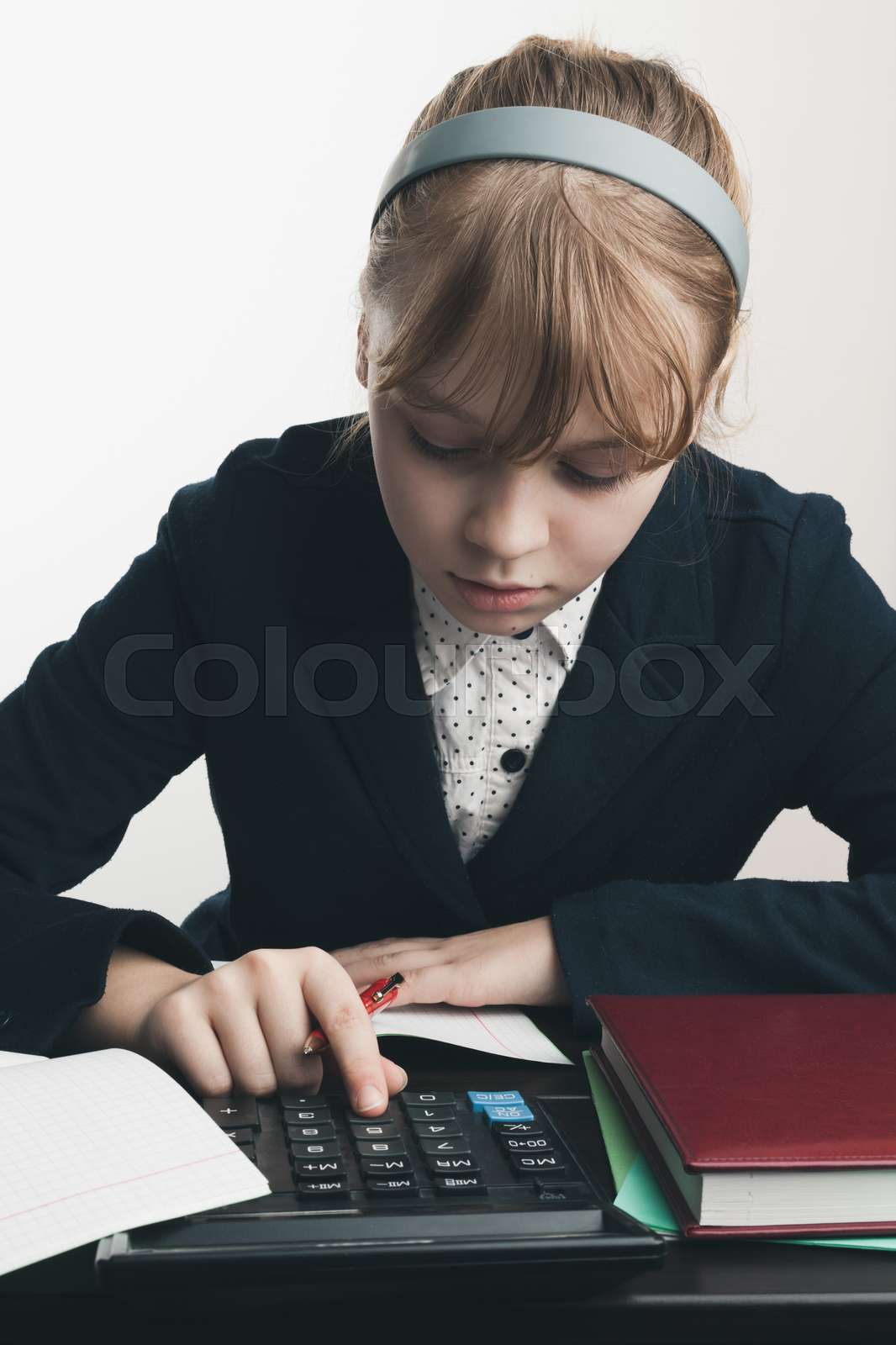 School girl using calculator, closeup portrait | Stock image | Colourbox