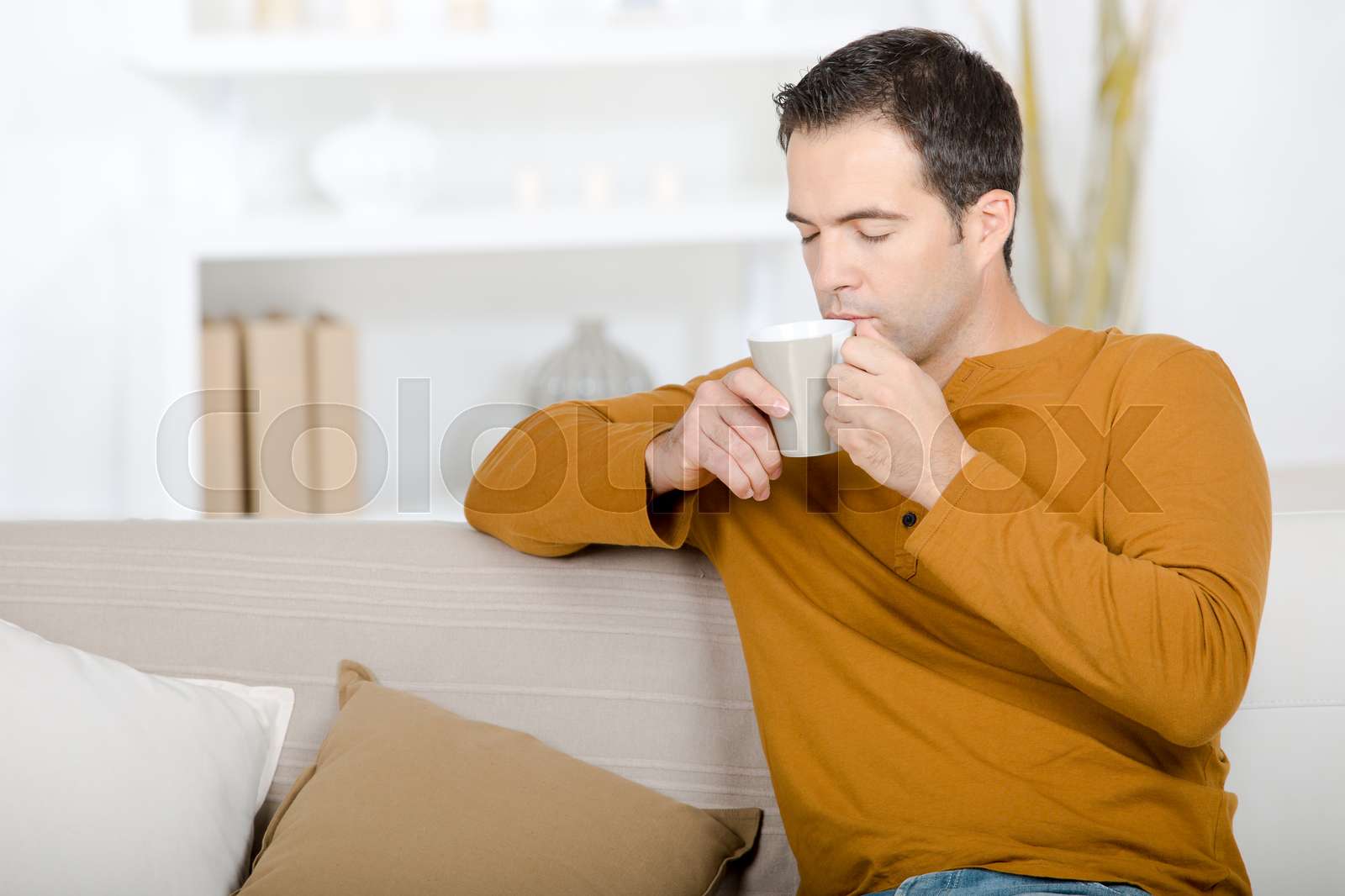 guy sniffing aroma of coffee | Stock image | Colourbox