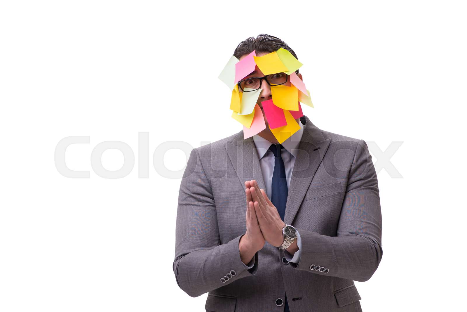 Businessman with many reminders isolated on white | Stock image | Colourbox