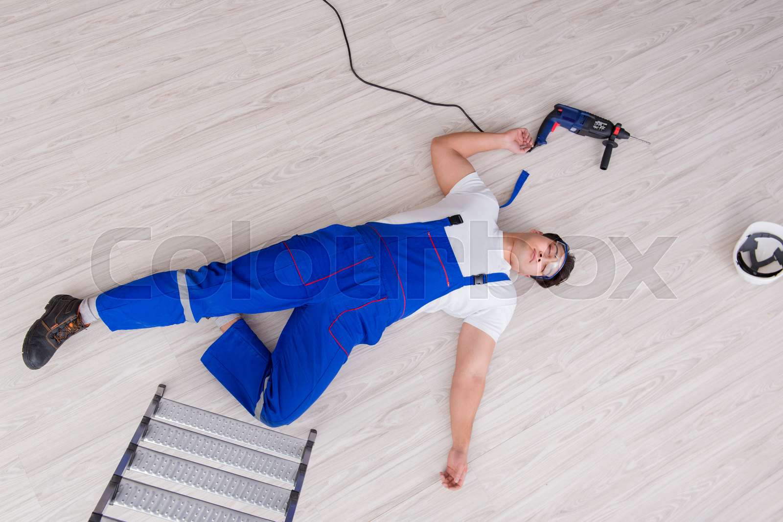 Worker after falling from height - unsafe behavior | Stock image ...