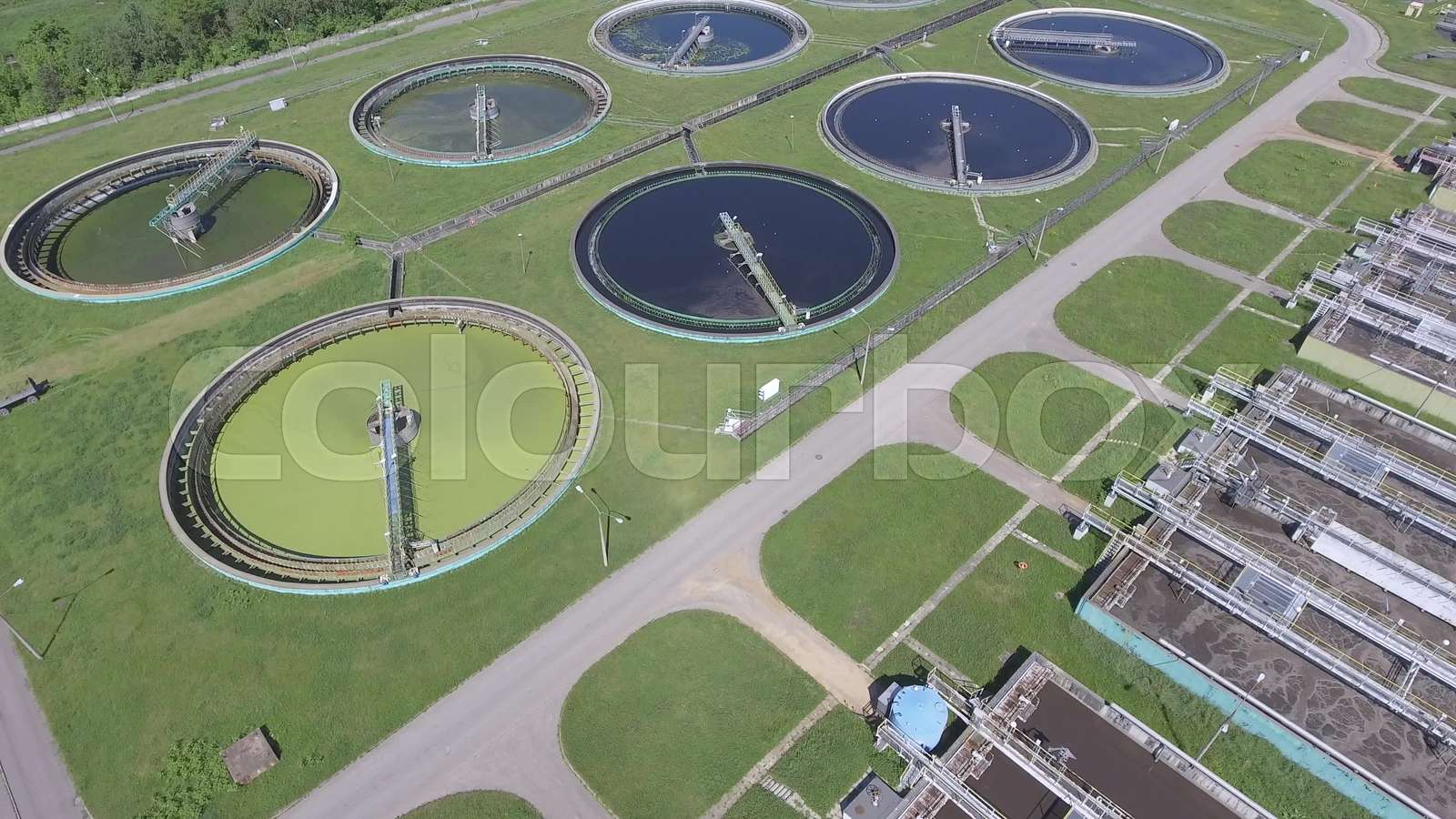 Sewage farm. Static aerial photo looking down onto the clarifying tanks ...