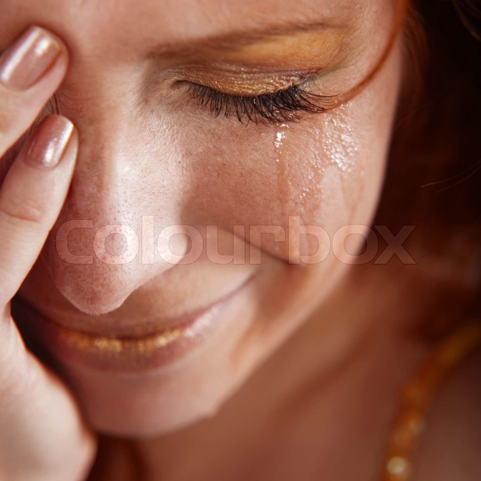 Closeup of crying woman with tears | Stock image | Colourbox