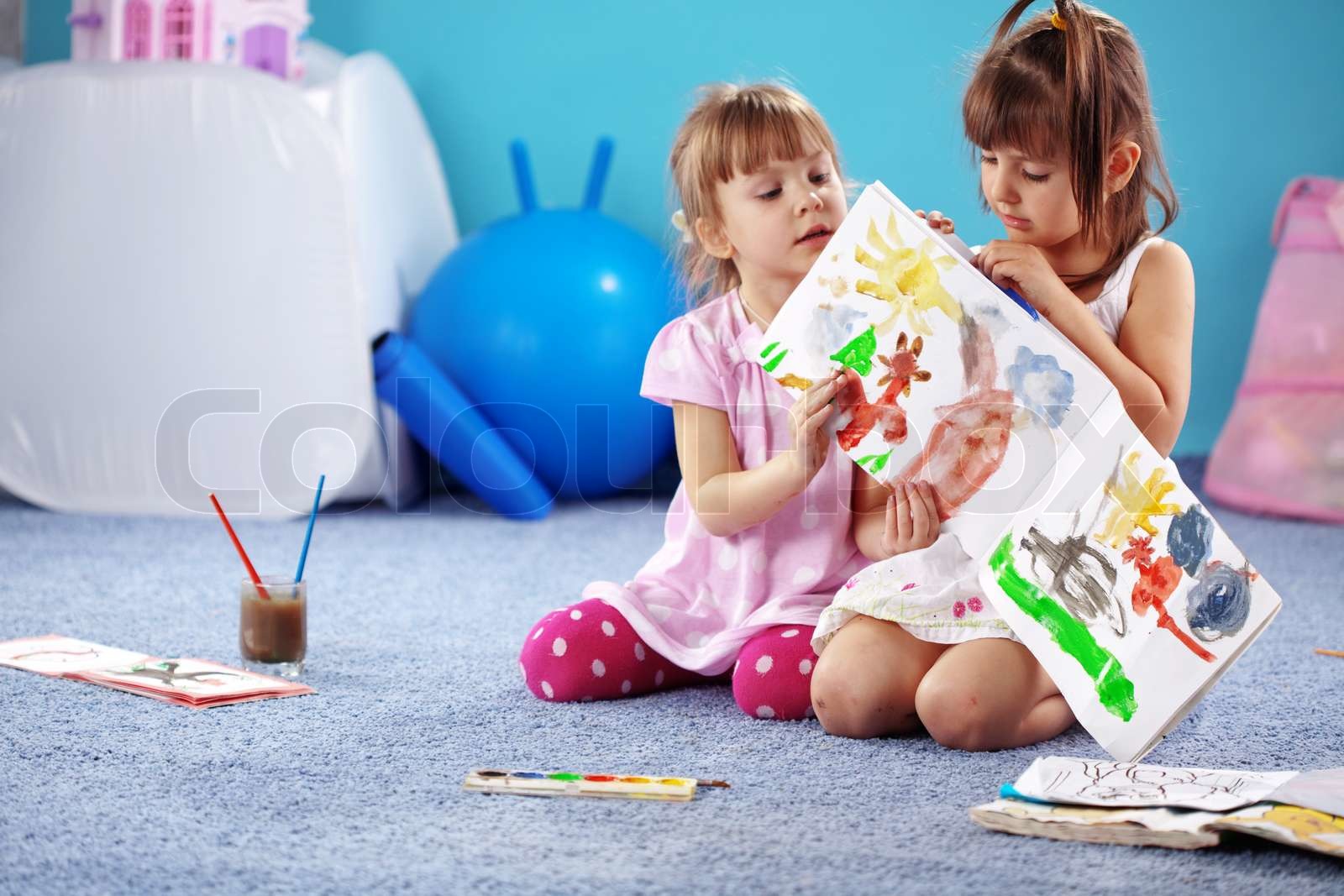 Children drawing in the nursery | Stock image | Colourbox