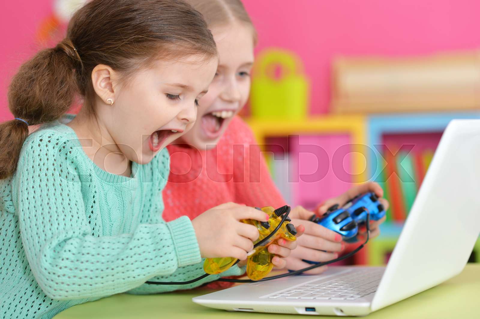 Two girls playing game | Stock image | Colourbox