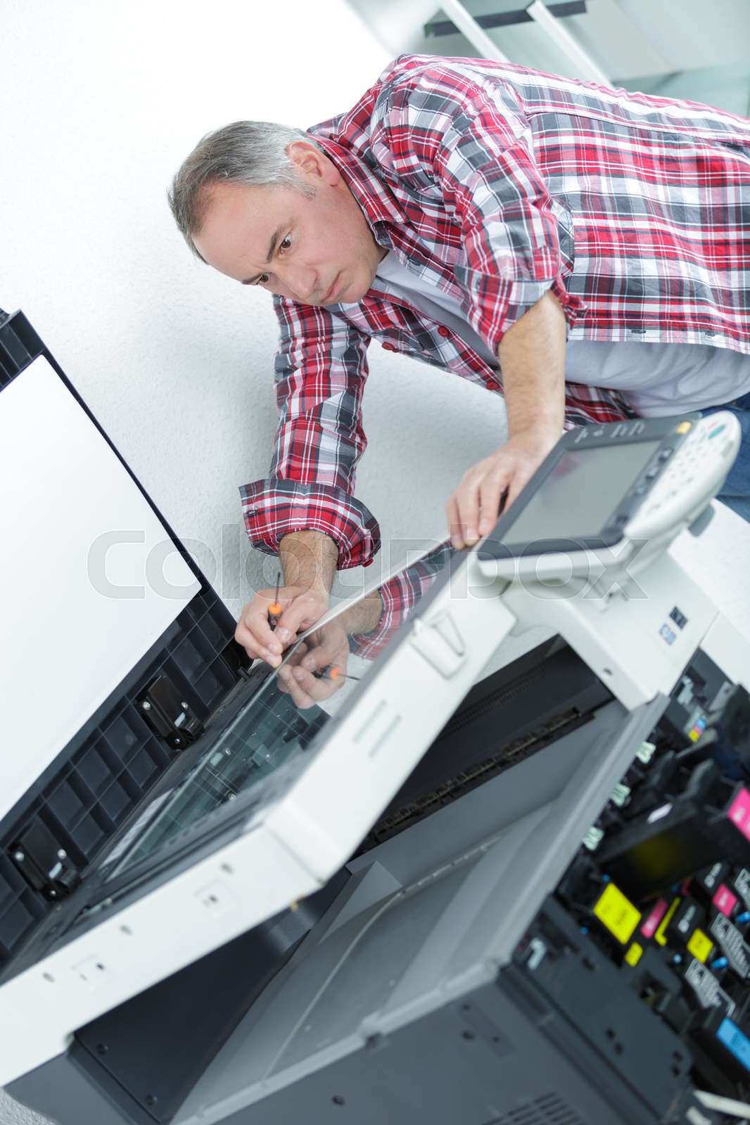 man technician repairing a printer at business place at work | Stock ...