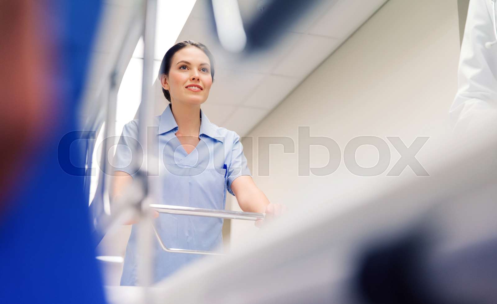 medic carrying hospital gurney at emergency | Stock image | Colourbox