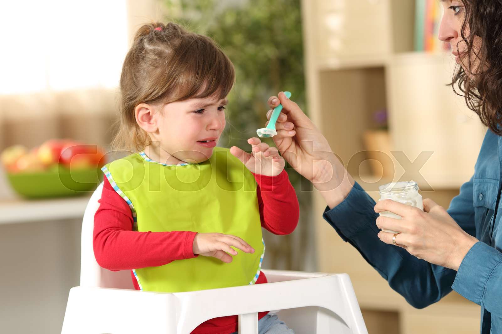 Toddler crying at lunch time | Stock image | Colourbox