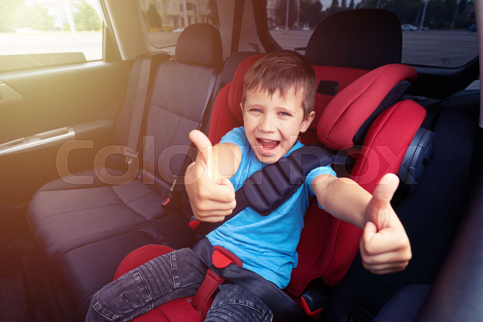 Smiling boy in the car | Stock image | Colourbox