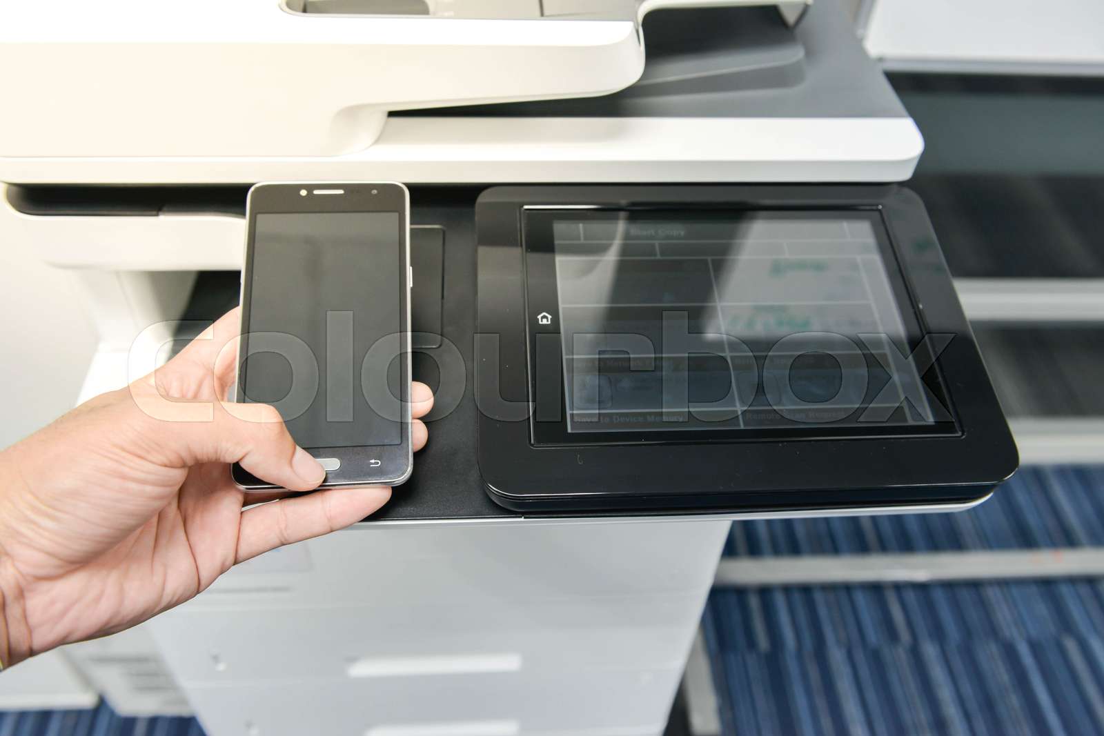 Using smart phone with printer to print the document | Stock image ...