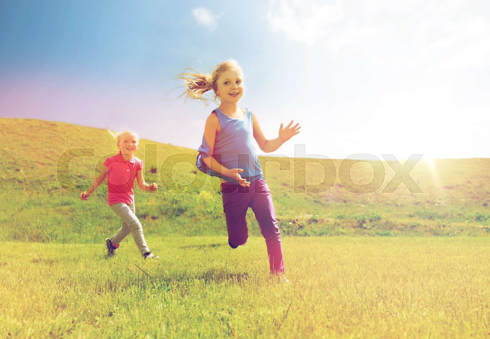 group of happy kids running outdoors | Stock image | Colourbox