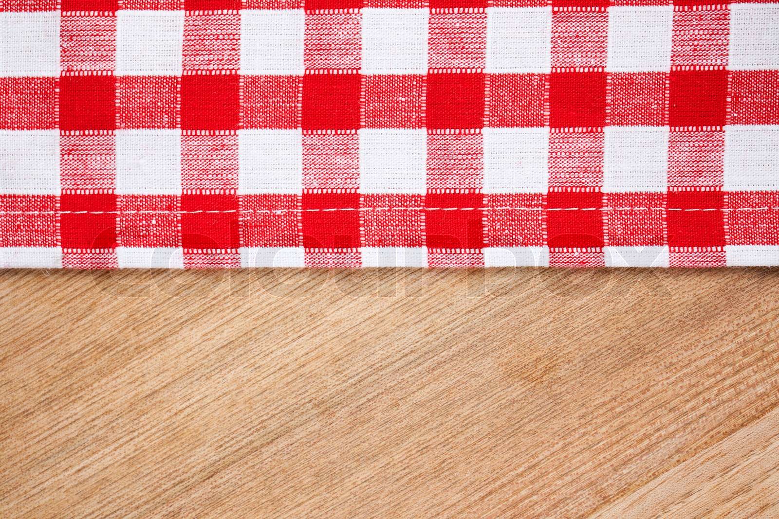 the checkered tablecloth on wooden table | Stock image | Colourbox