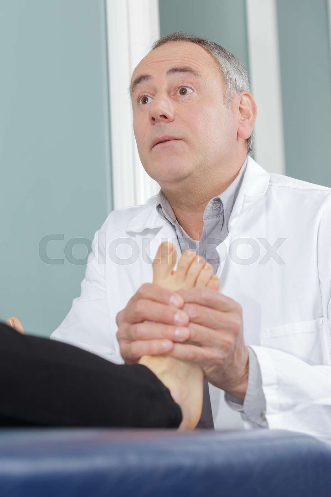 Doctor And Patient Examination Of The Feet Stock Image Colourbox