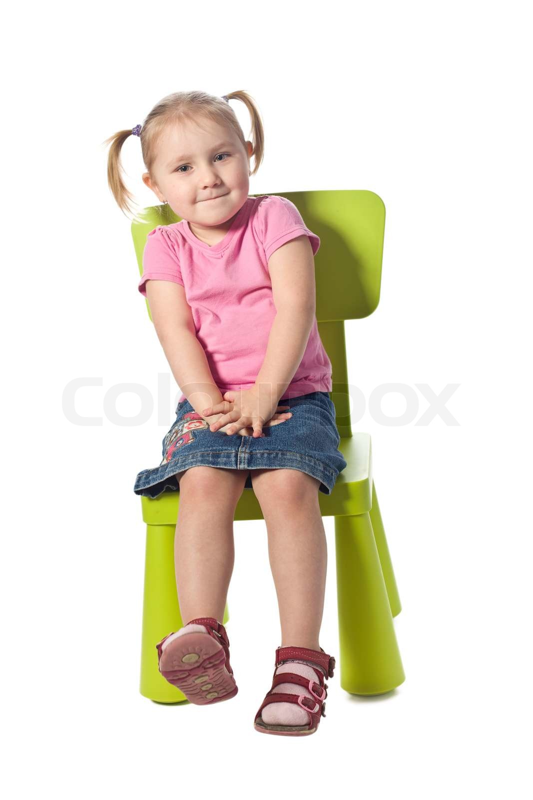 the little child sits on a chair | Stock image | Colourbox
