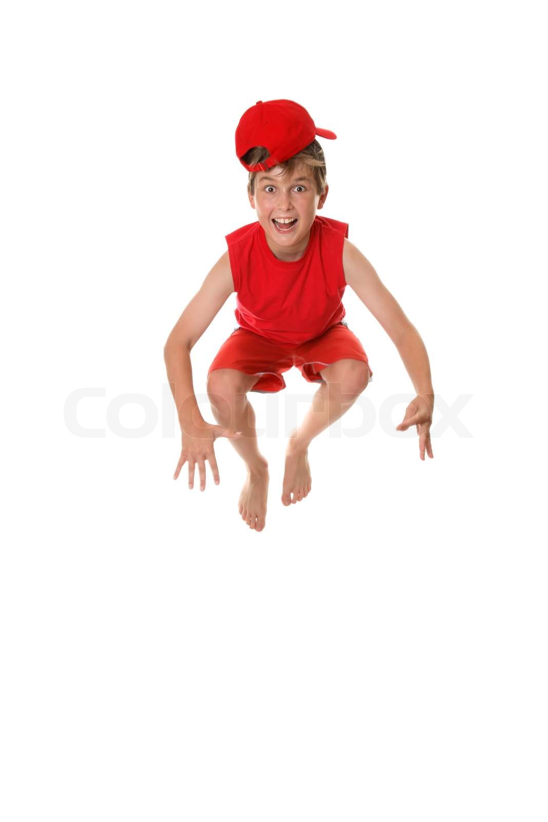 A happy boy jumps up and down for fun | Stock image | Colourbox