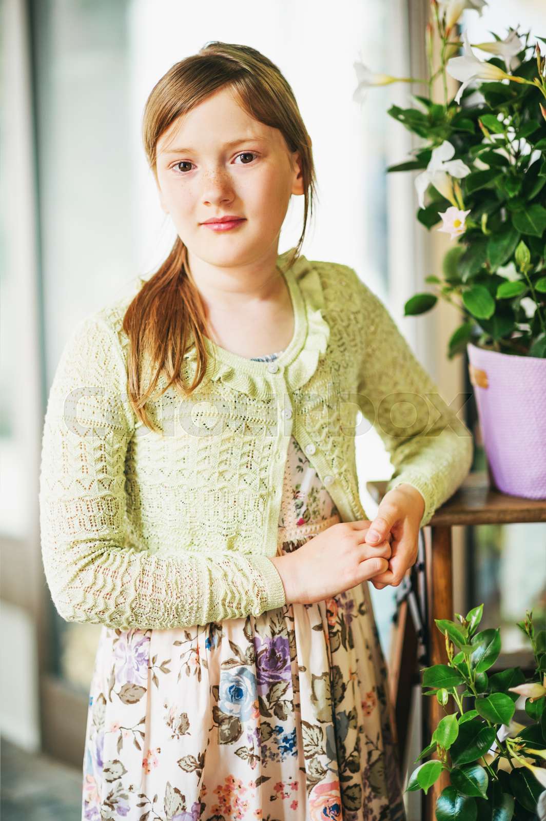 Outdoor portrait of pretty 9-10 year old girl, wearing summer dress ...