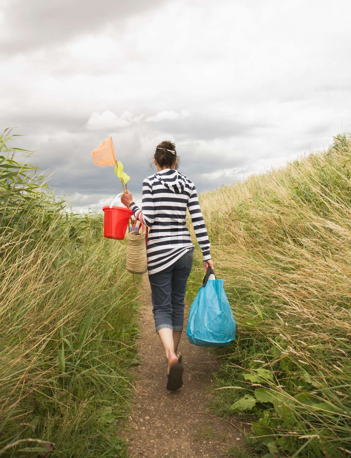 Woman walking down path | Stock image | Colourbox
