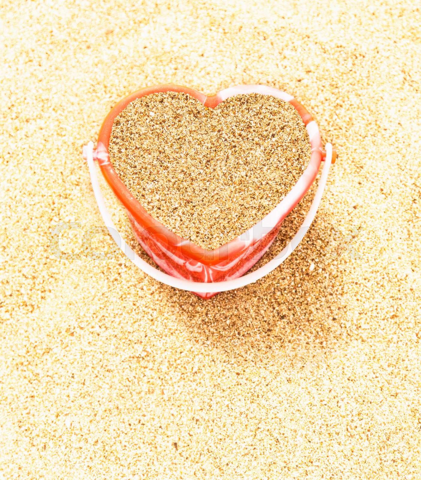 Heart shaped bucket of sand | Stock image | Colourbox