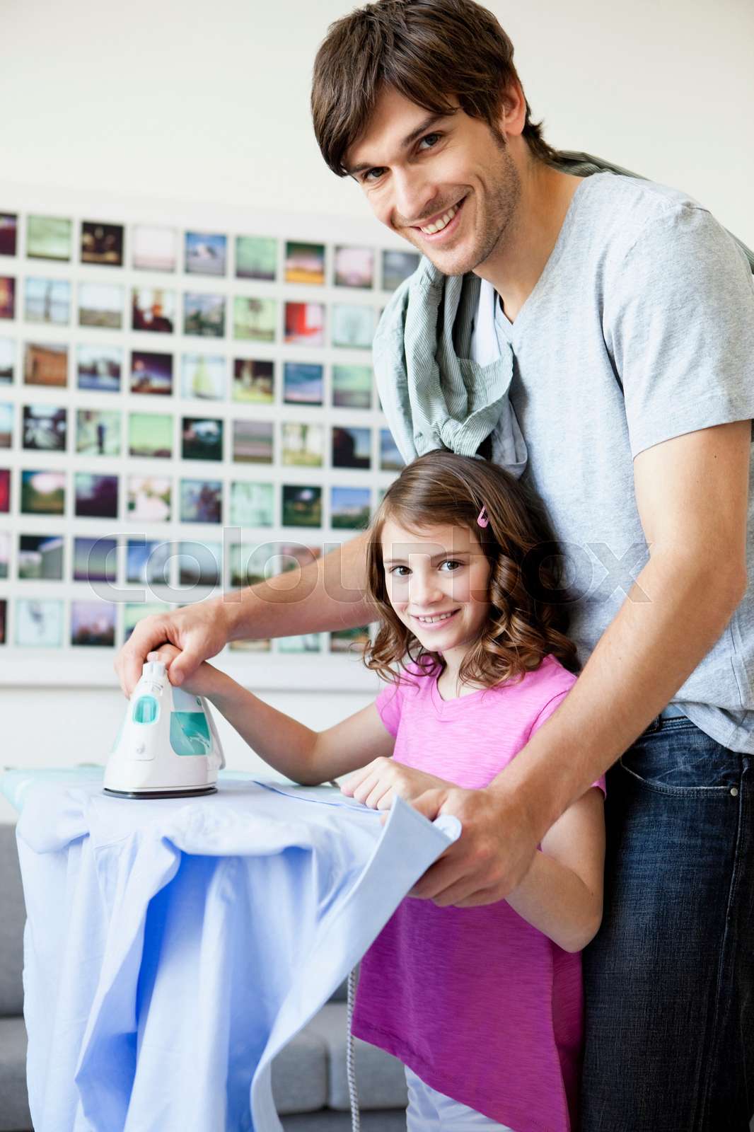 Father and daughter ironing | Stock image | Colourbox