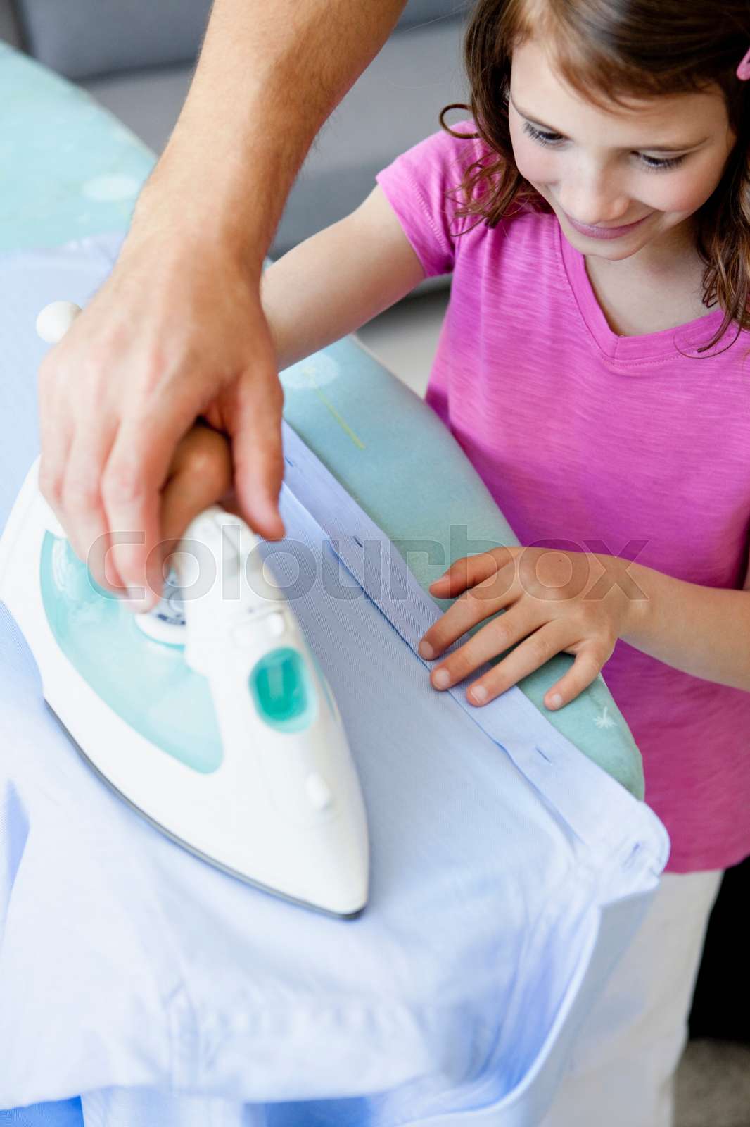 Girl ironing | Stock image | Colourbox
