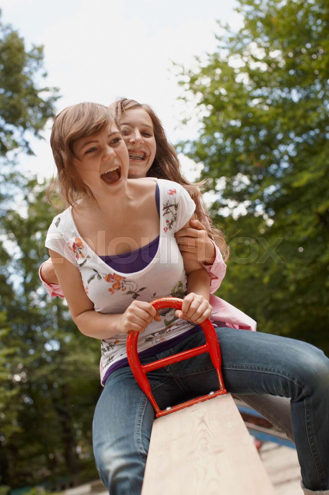 2 girls having fun together in a park | Stock image | Colourbox