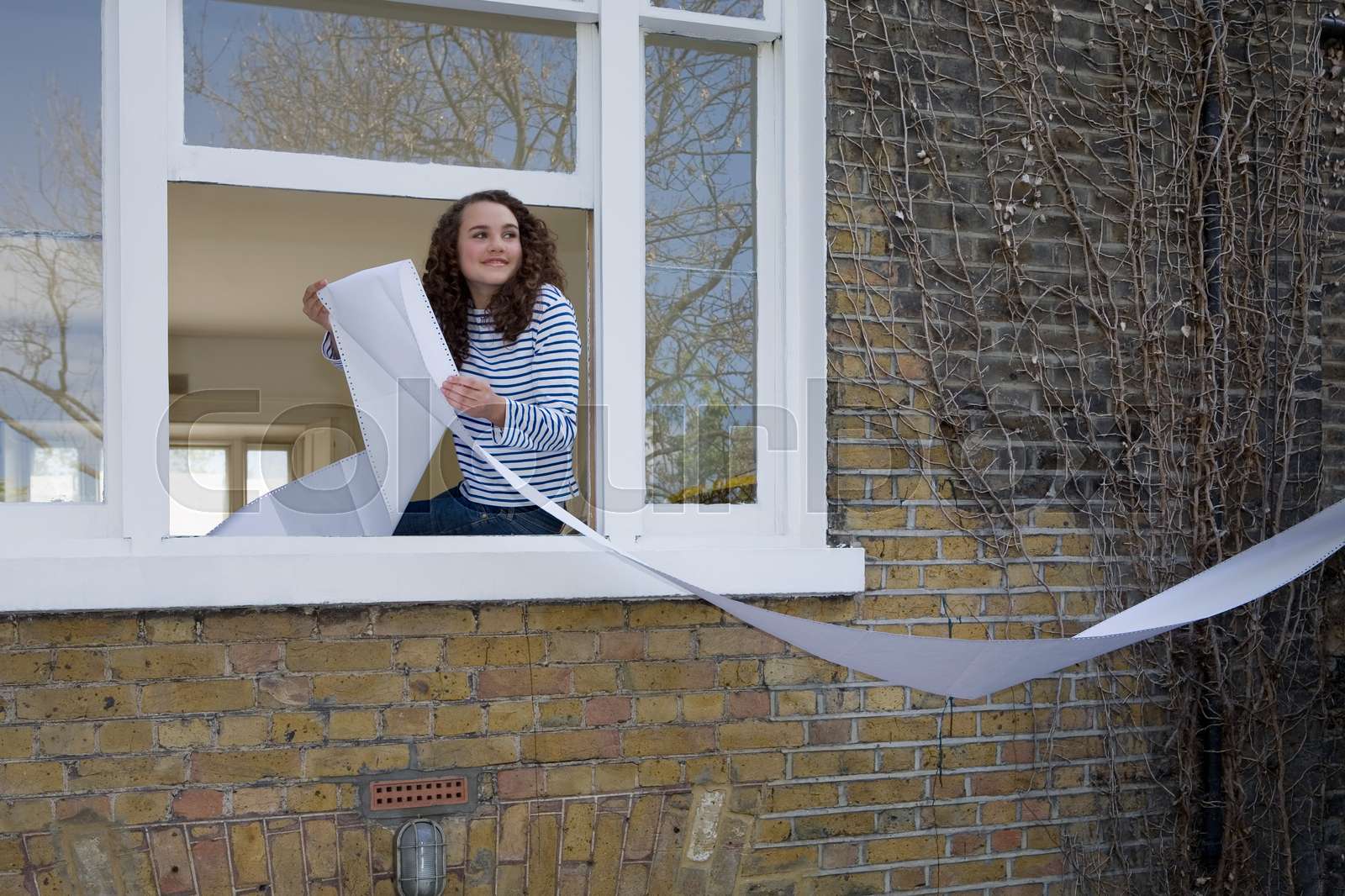 Teenage girl being mischievous | Stock image | Colourbox