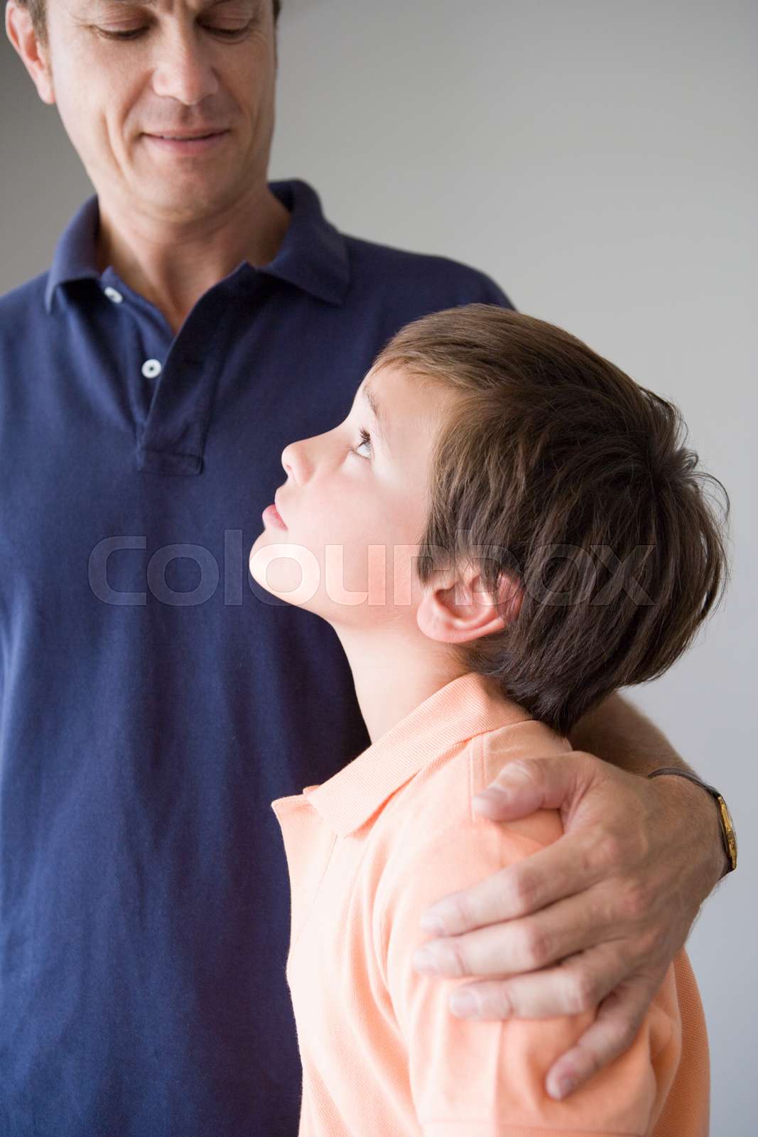 Son looking up to father | Stock image | Colourbox