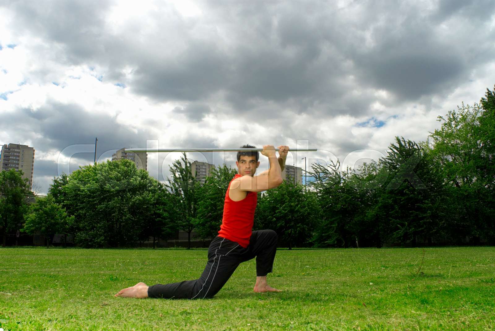 man posing with bow staff | Stock image | Colourbox