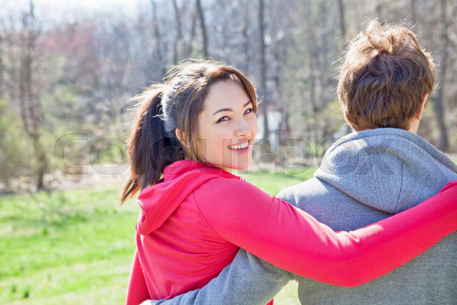 Girl with arm around boy | Stock image | Colourbox