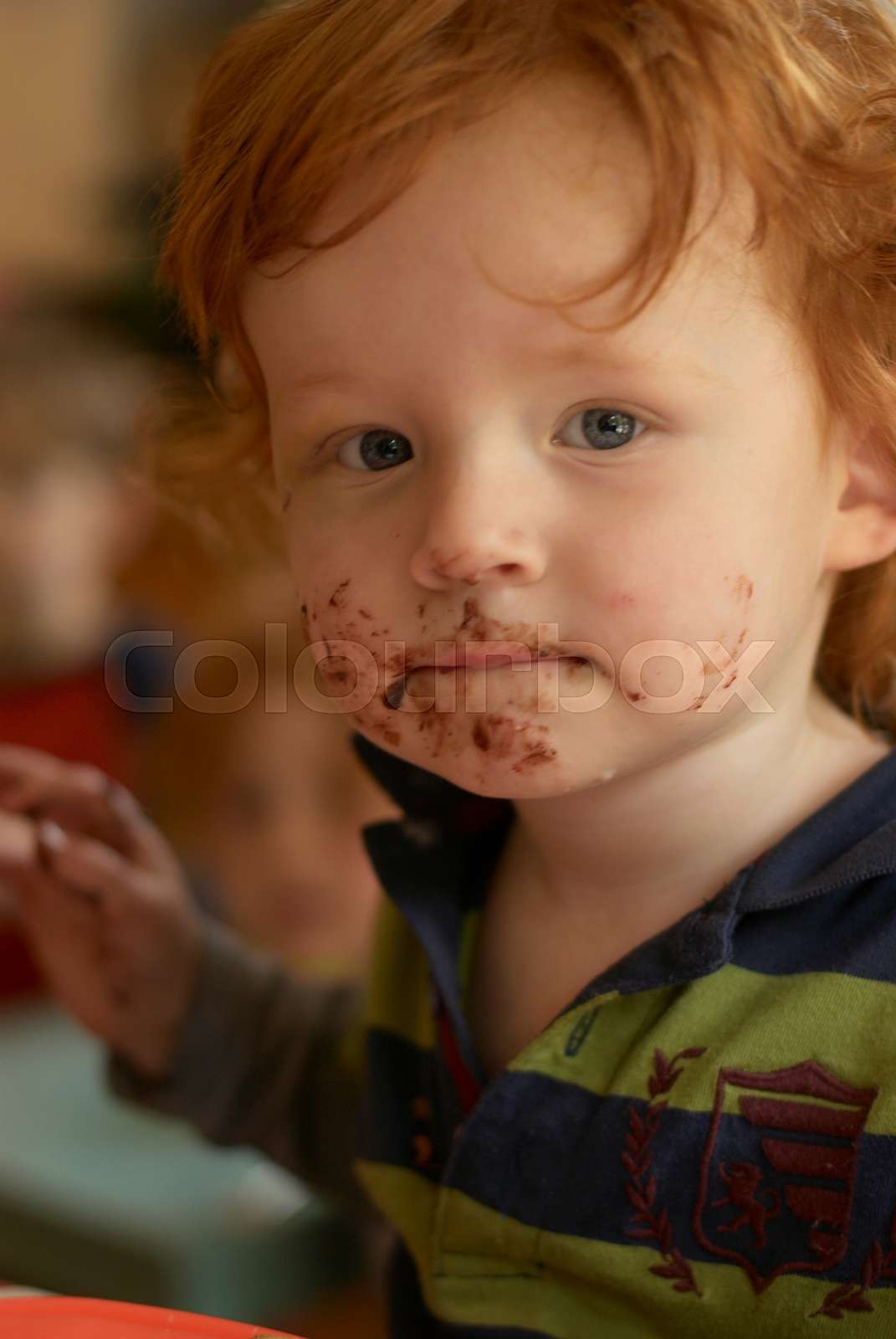 Young boy with messy face | Stock image | Colourbox