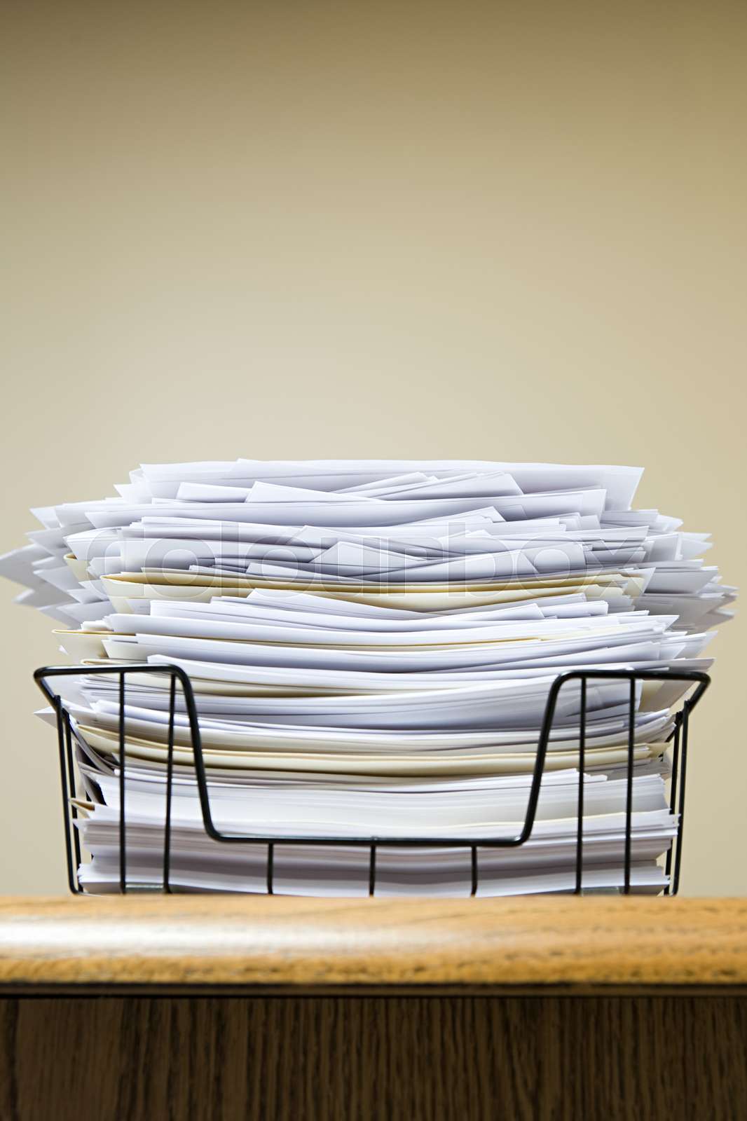 Overflowing paper inbox | Stock image | Colourbox
