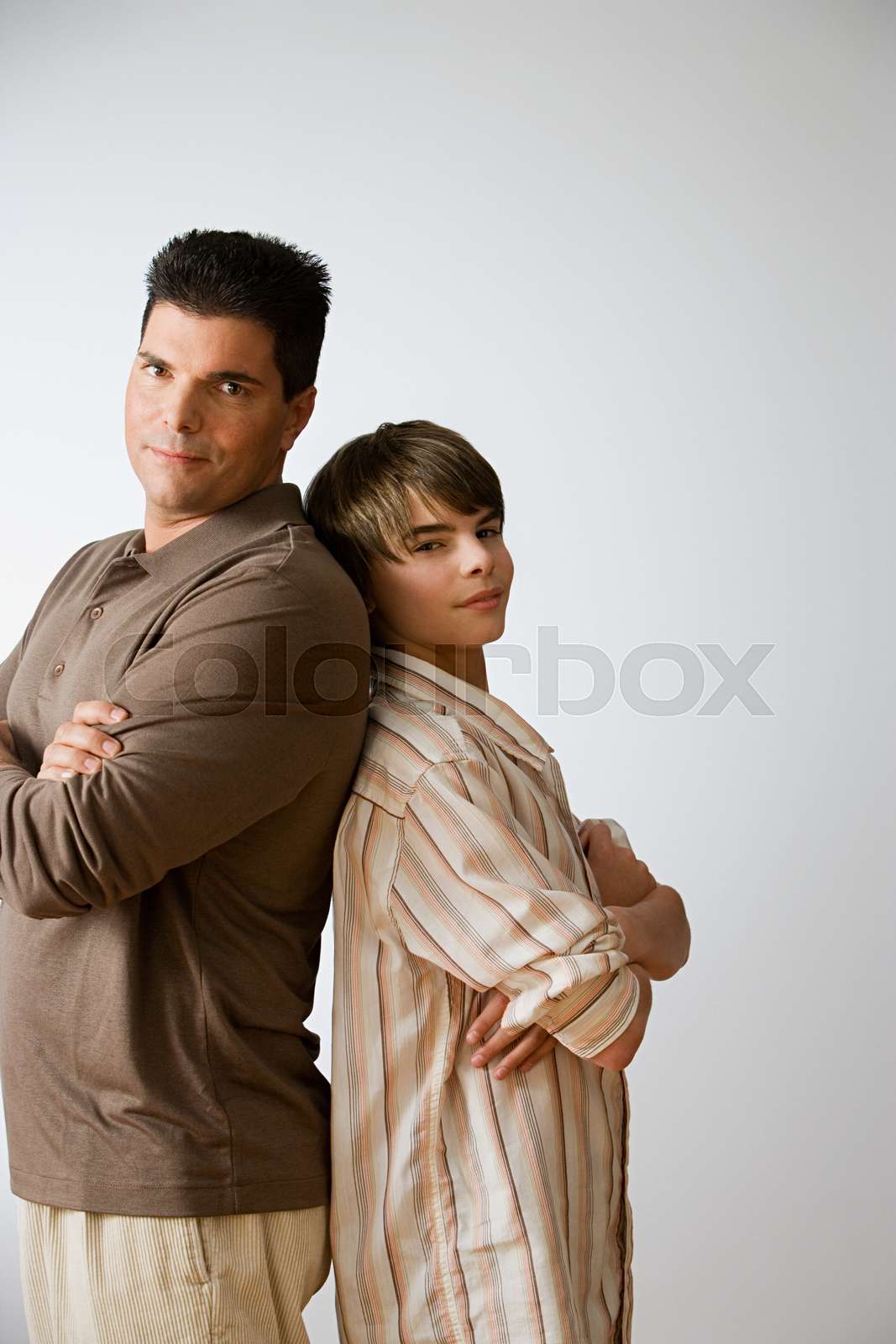 Father and son back to back | Stock image | Colourbox