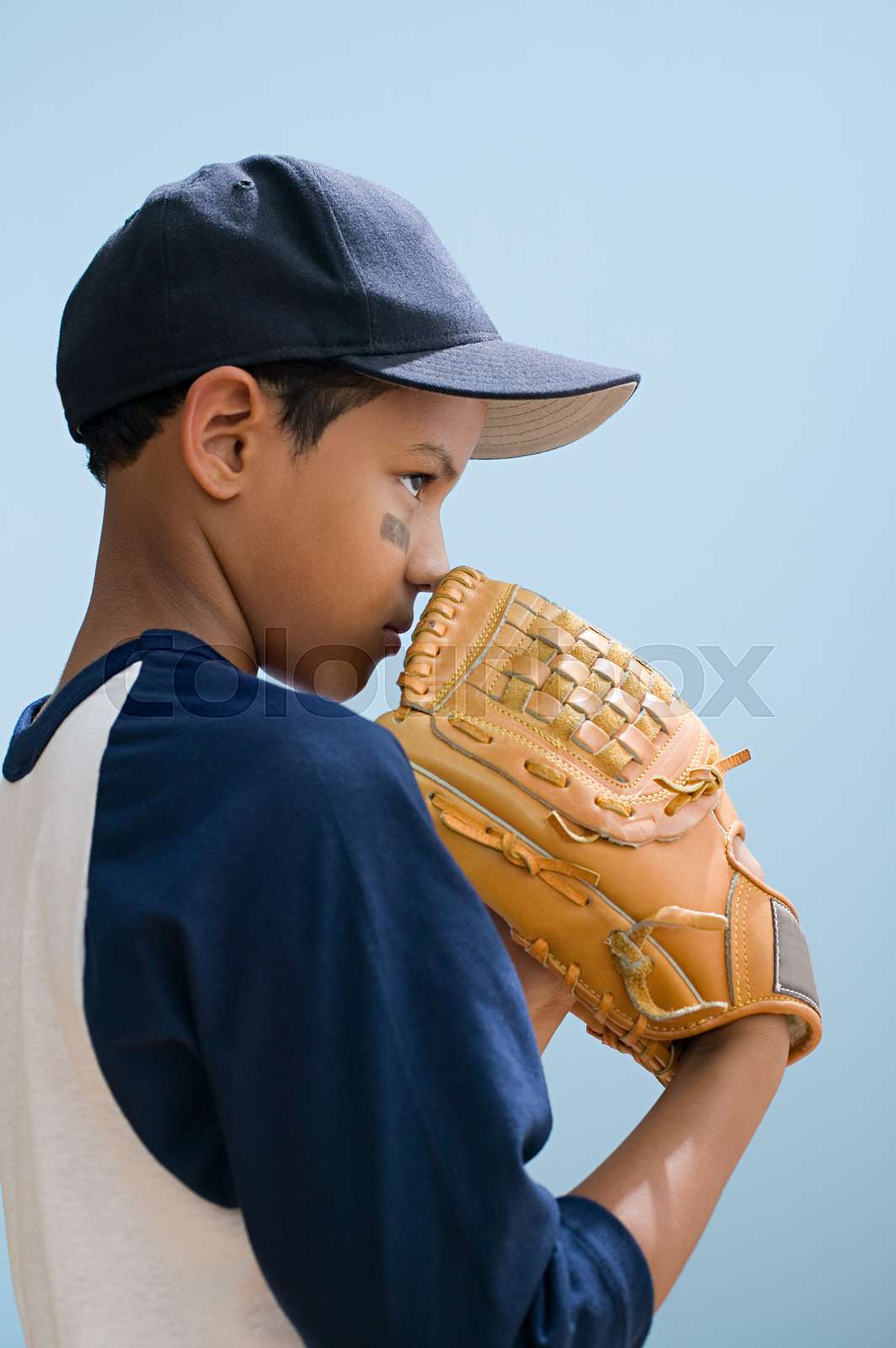 Boy in baseball clothing | Stock image | Colourbox
