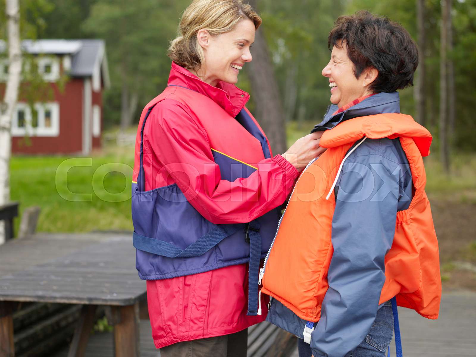 Woman helping another woman | Stock image | Colourbox