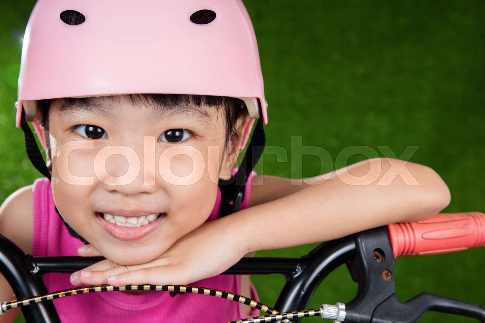 Asian Chinese little girl riding bicycle | Stock image | Colourbox